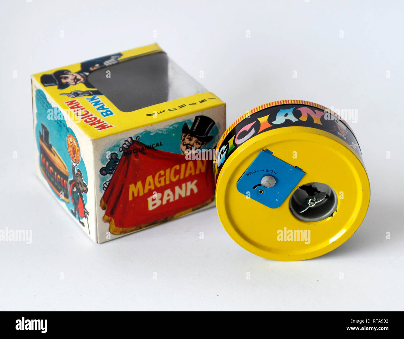 Vintage tin toy magician bank Stock Photo - Alamy