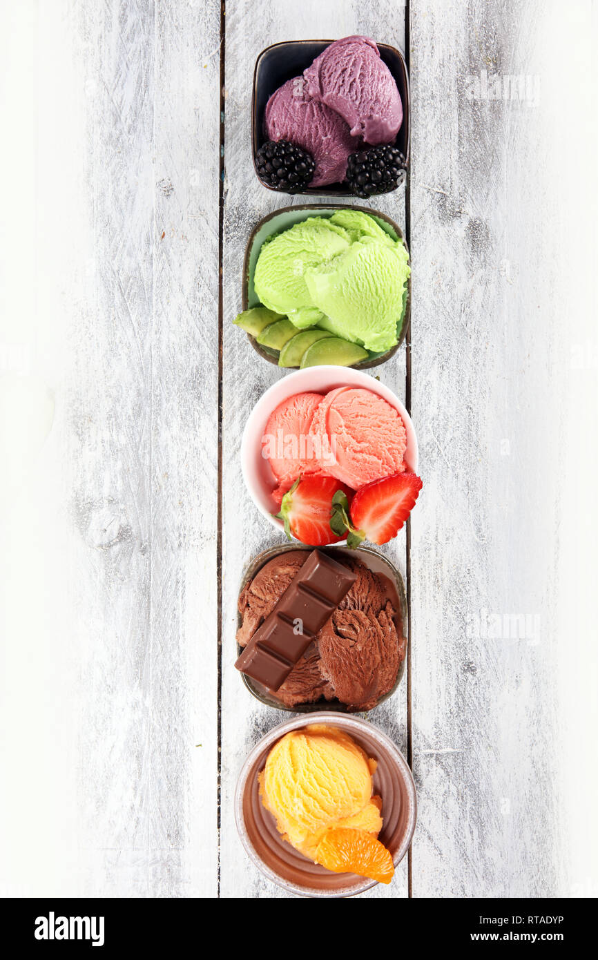 Set of ice cream scoops of different colors and flavours with berries ...