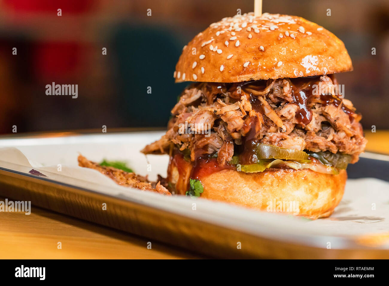 Close up tasty burger with minced meat served on tray Stock Photo - Alamy