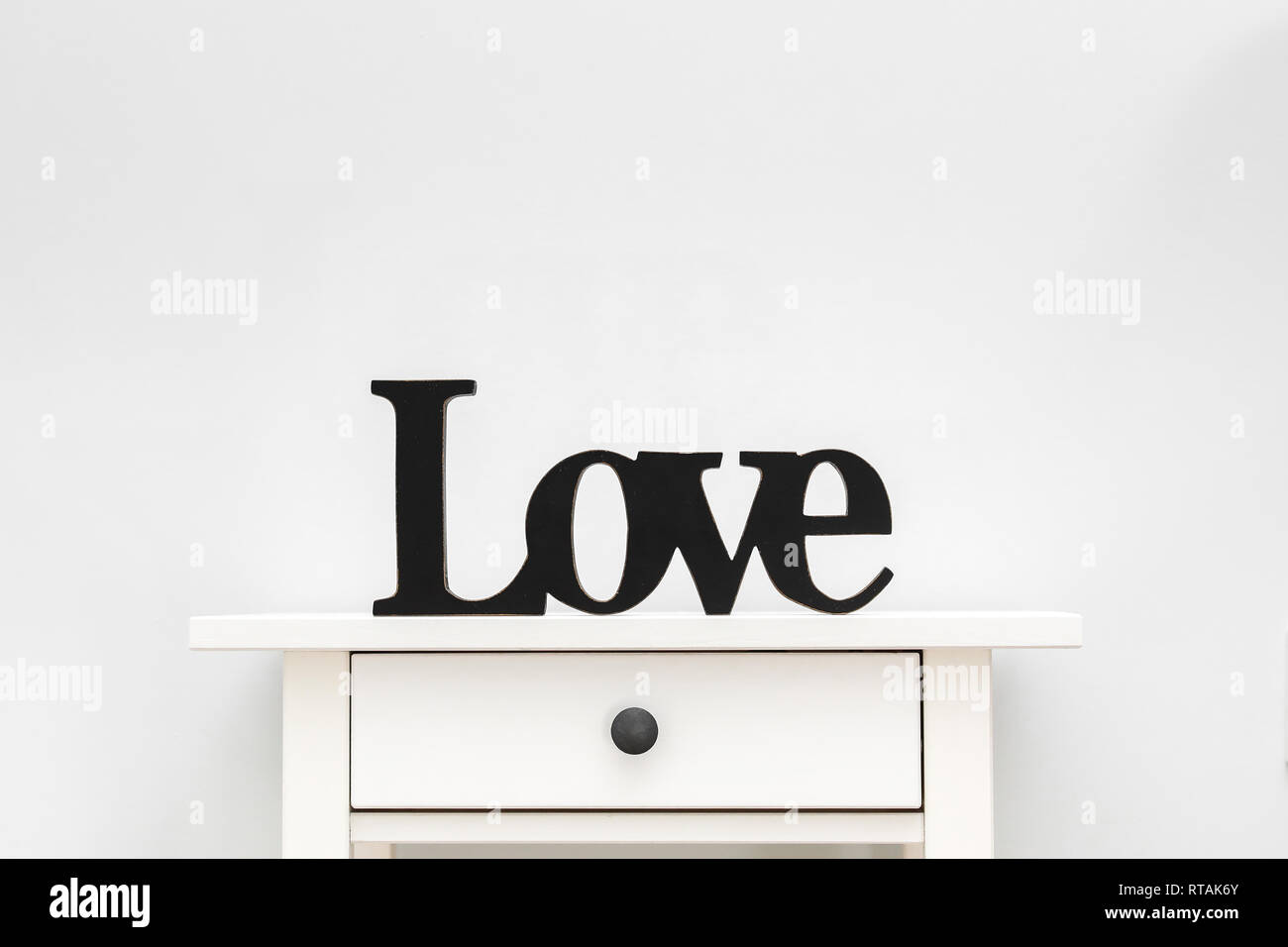 cut out wood letter. Letters LOVE on a white background Stock Photo - Alamy