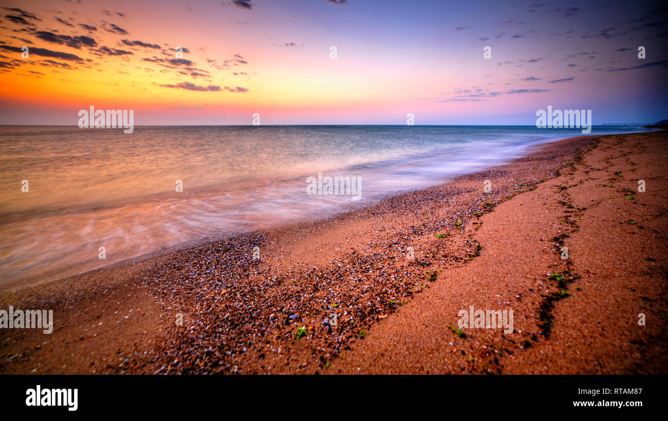 Beautiful sunrise over the beach Stock Photo - Alamy