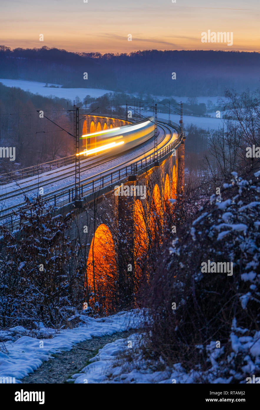 Long exposure of train on viaduct Stock Photo - Alamy