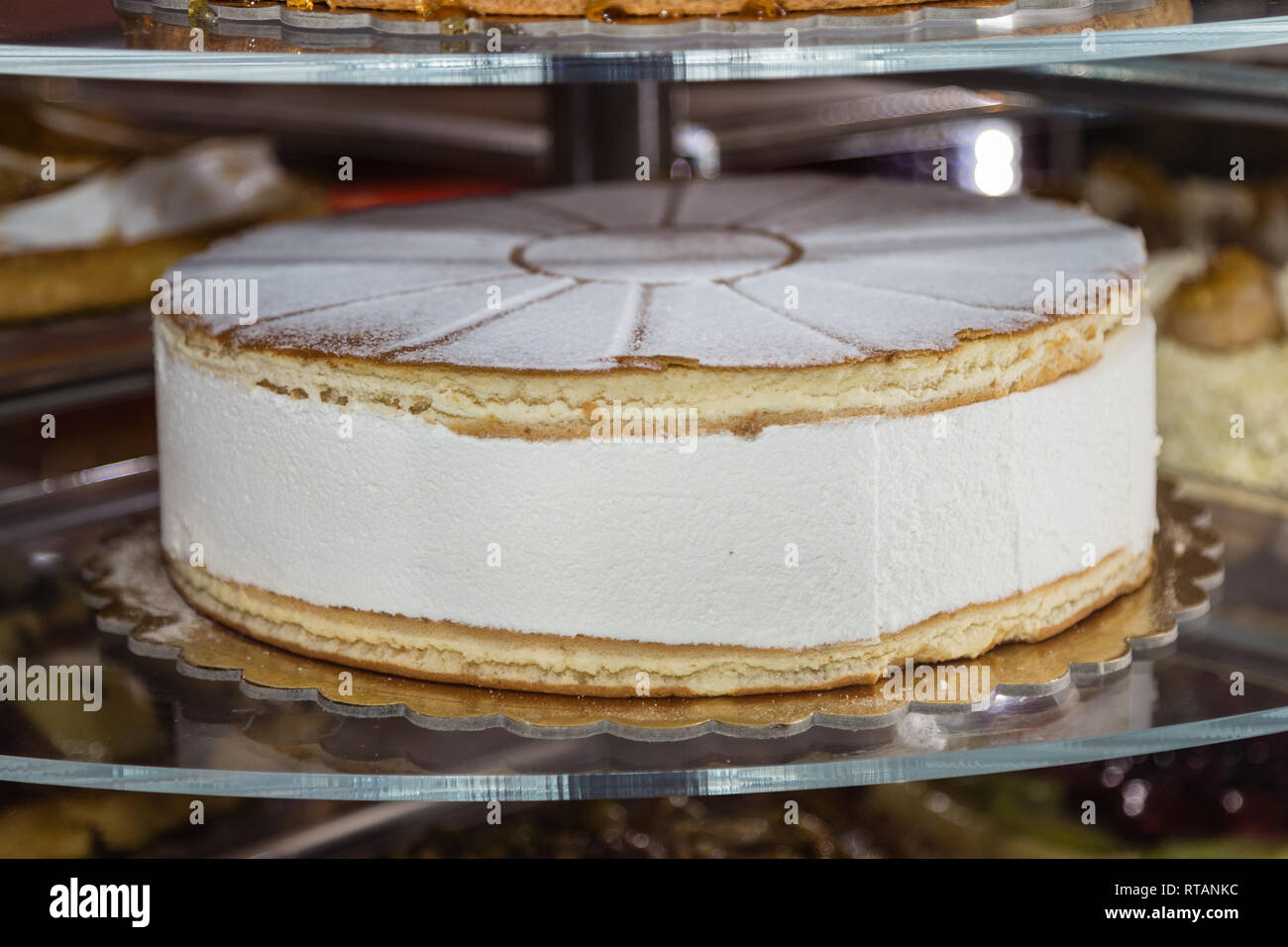 Big Cheesecake inside a Pastry Display Stand Stock Photo - Alamy