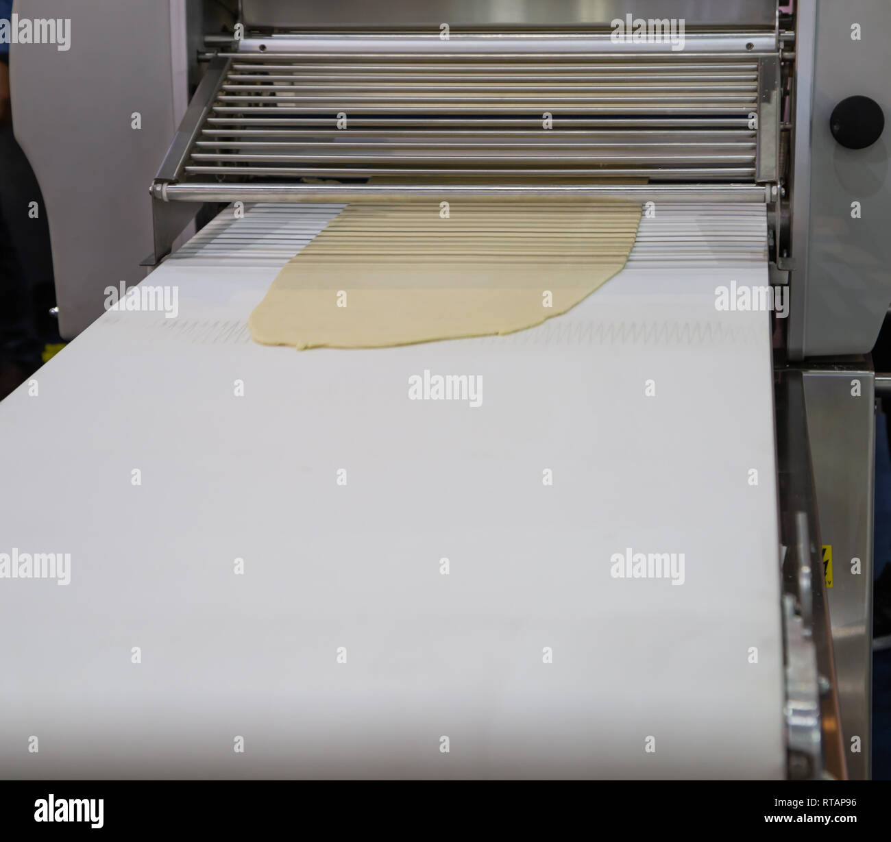 Dough sheeter machine for bakery production line Stock Photo - Alamy