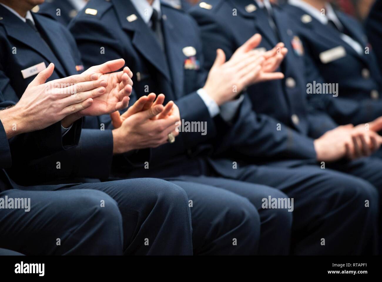 Air Force Combat Systems officers applaud before receiving their wings ...