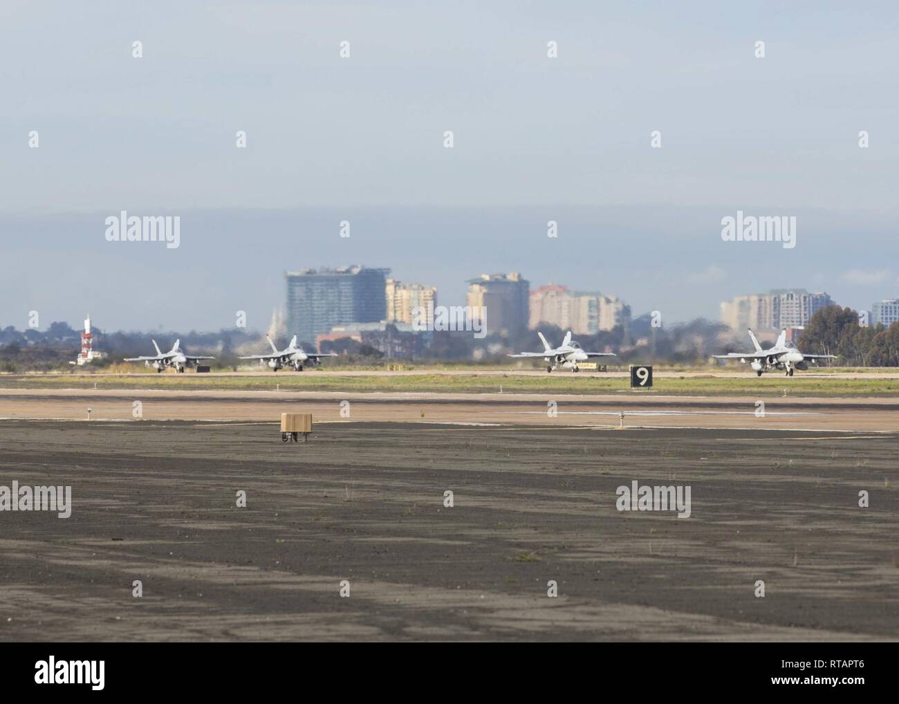 F/A-18C Hornets with Marine Aircraft Group (MAG) 11, taxi in ...