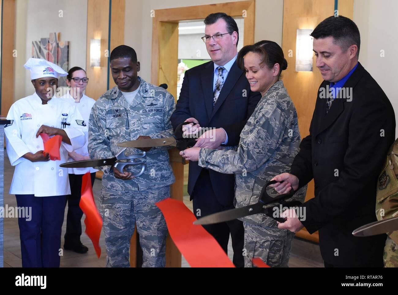 Left to right, Col. Terrence Adams, 628th Air Base Wing commander, joins David McDonald, DAVCO ...