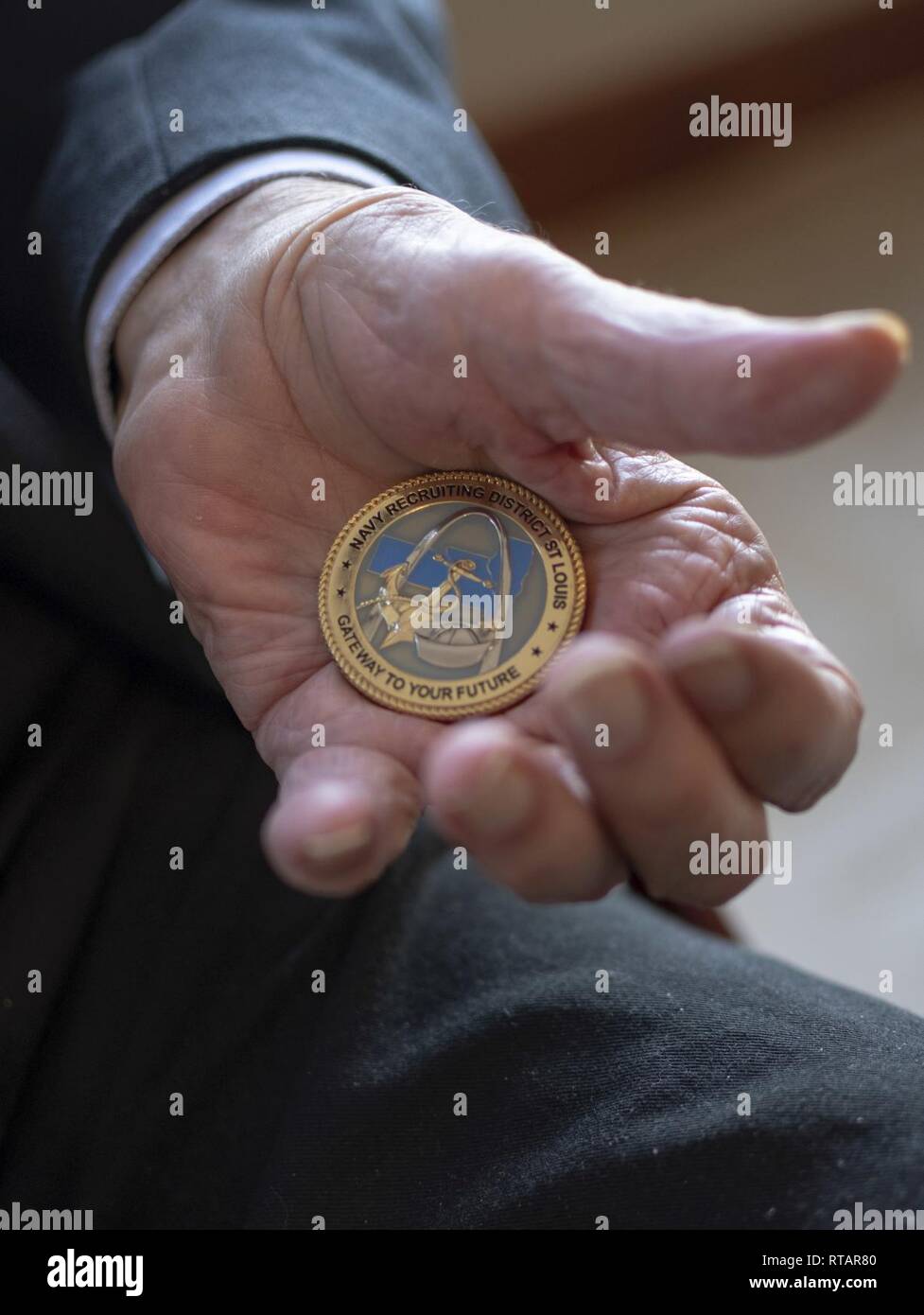 ST. LOUIS (Feb. 1, 2019) Joseph Logan holds a command coin from Navy ...