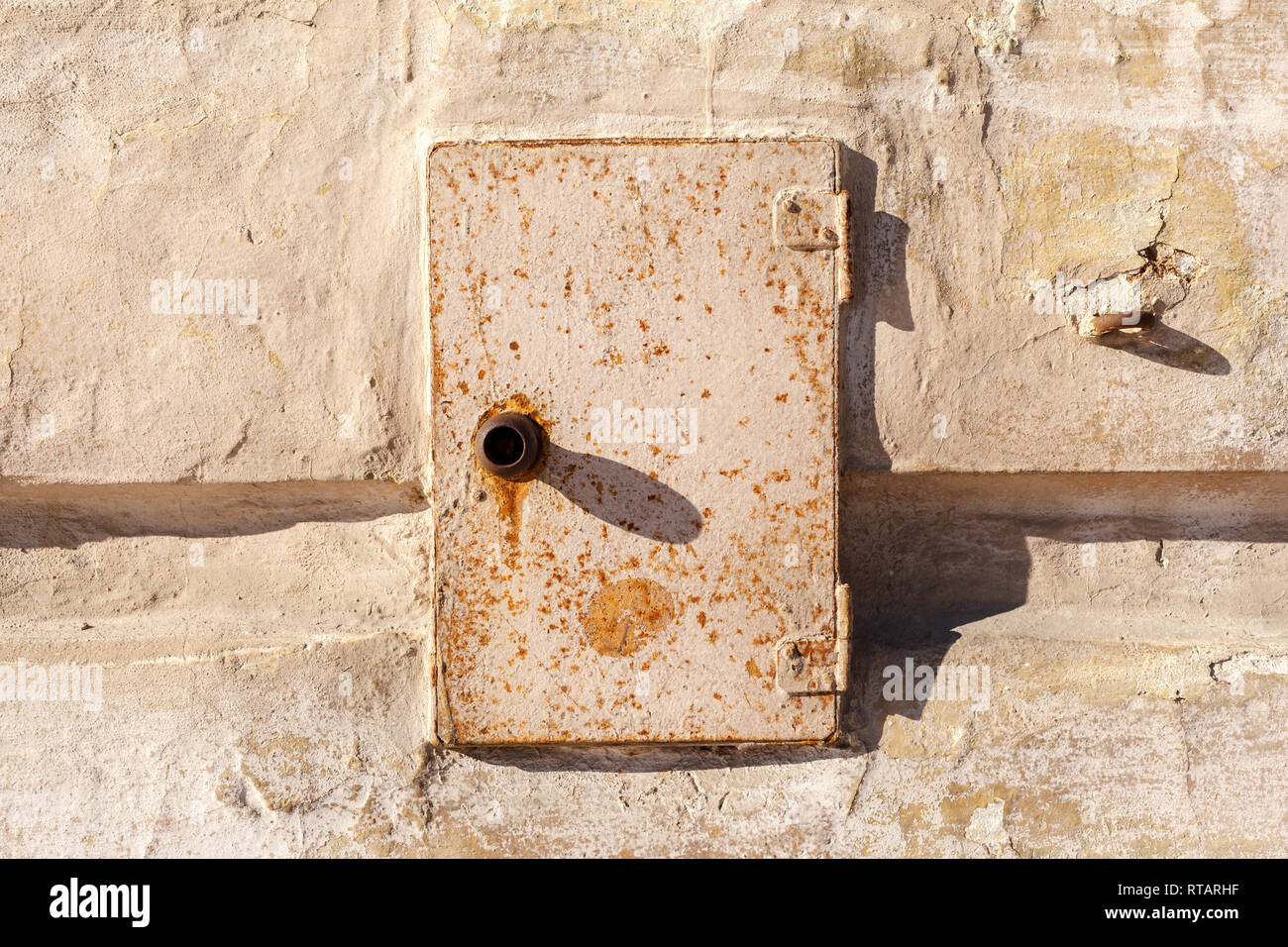 Rusty metal door of the electric box. Old abandoned electrical junction ...