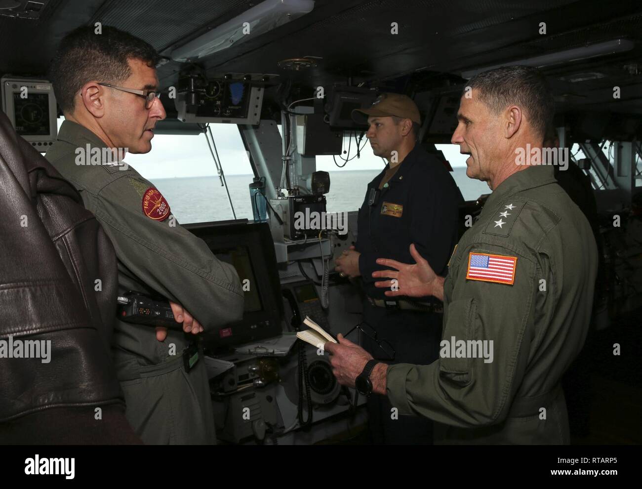 ATLANTIC OCEAN (Feb. 1, 2019) Vice Adm. Andrew Lewis (right) speaks to ...
