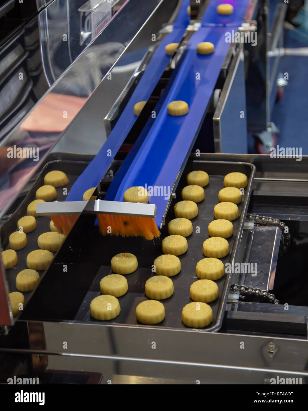 Production line of automatic moon cake stamping machine and Stock Photo ...