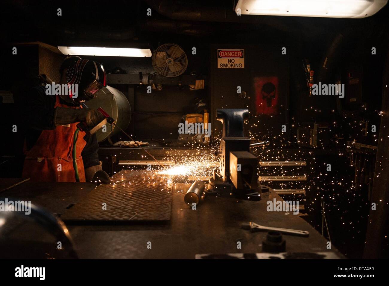 U.S. Navy Fireman Jonah Russell, from Merrimack, New Hampshire, uses a ...