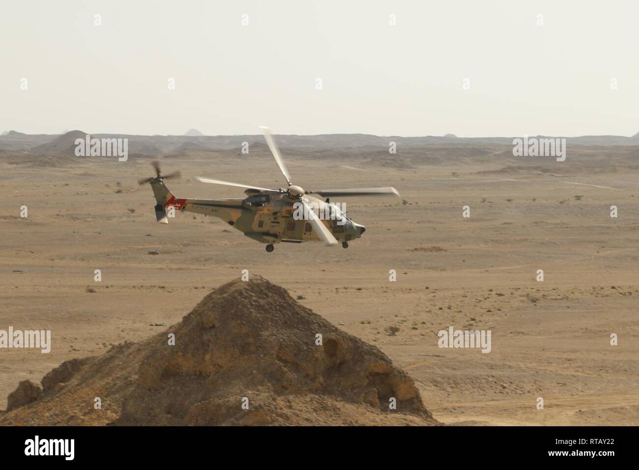 A Royal Air Force of Oman NH-90 helicopter takes a hard right to ...