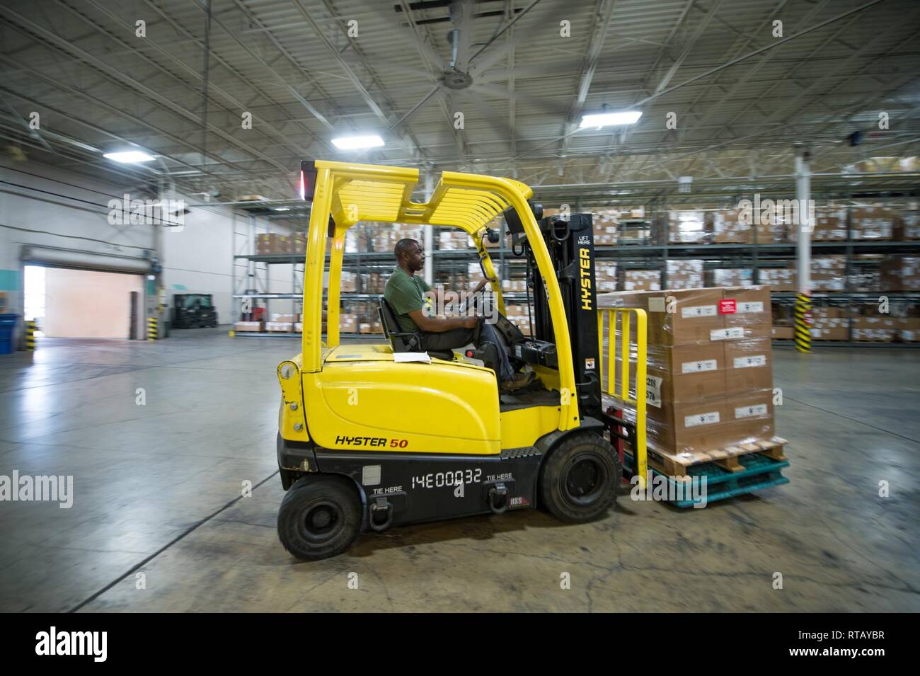 Willie Young, 502d Logistics Readiness Squadron material handler, loads ...