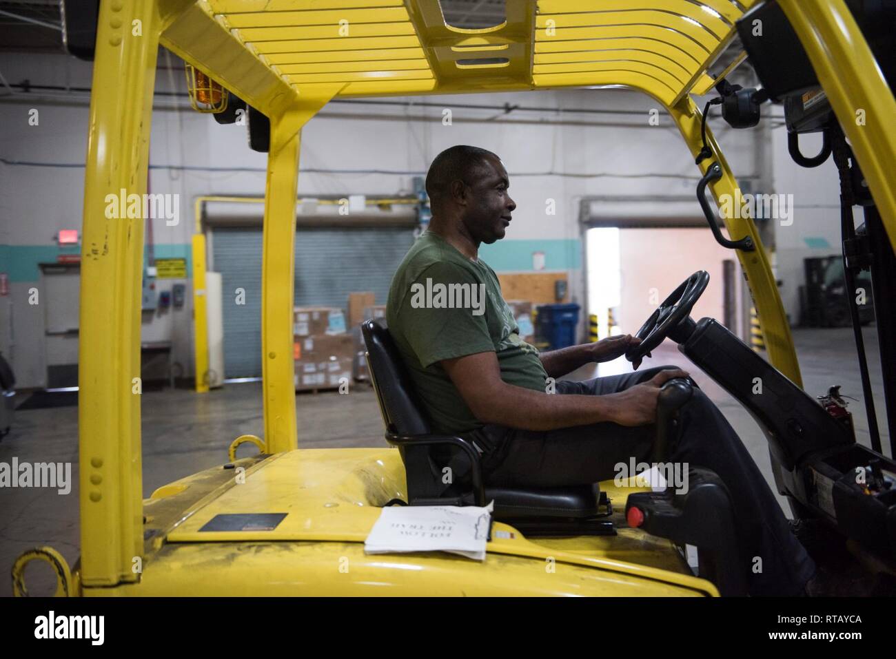 Willie Young, 502d Logistics Readiness Squadron material handler, loads ...
