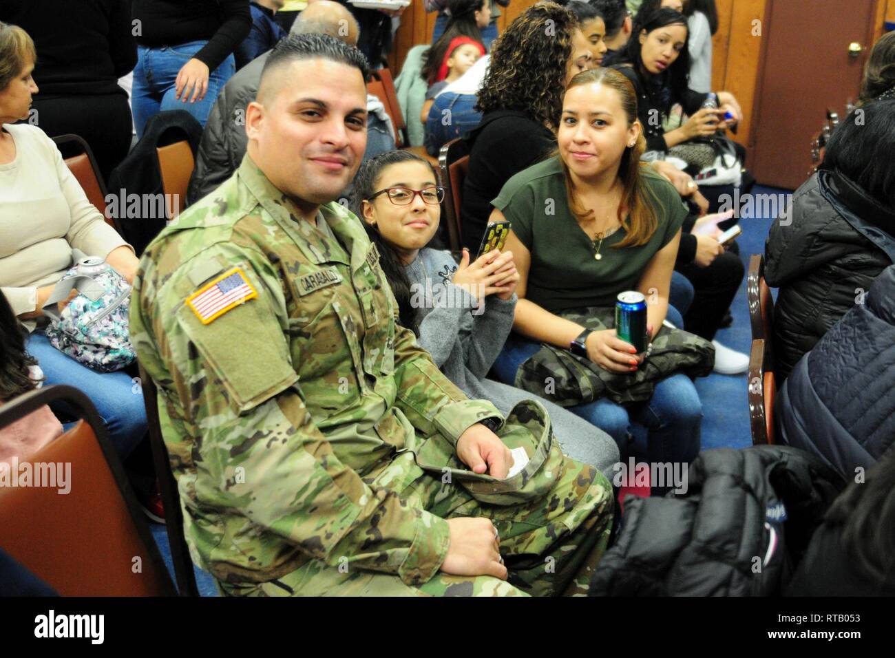 Sgt. Josie P. Caraballo poses with his family at the 250th Brigade ...