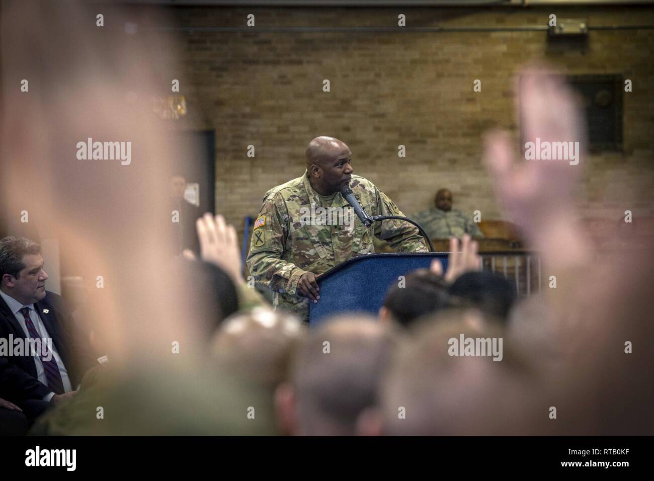 U.S. Army Soldiers raise their hands indicating that this is their ...