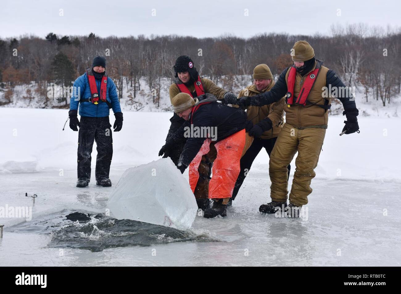 U.S. Navy divers from the Mobile Diving and Salvage Unit Two are ...