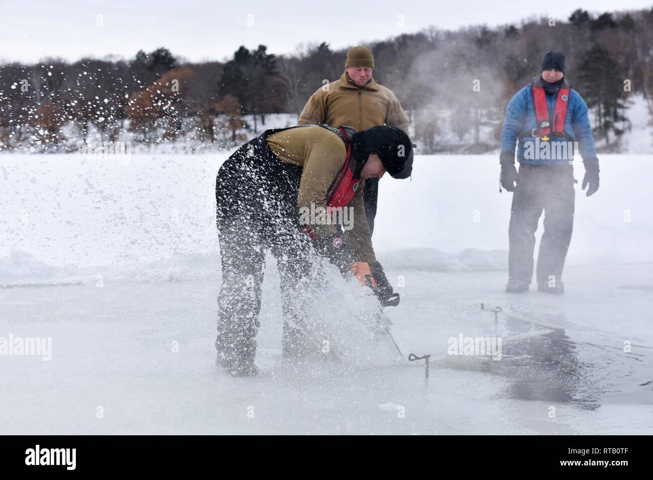 U.S. Navy divers from the Mobile Diving and Salvage Unit Two are ...