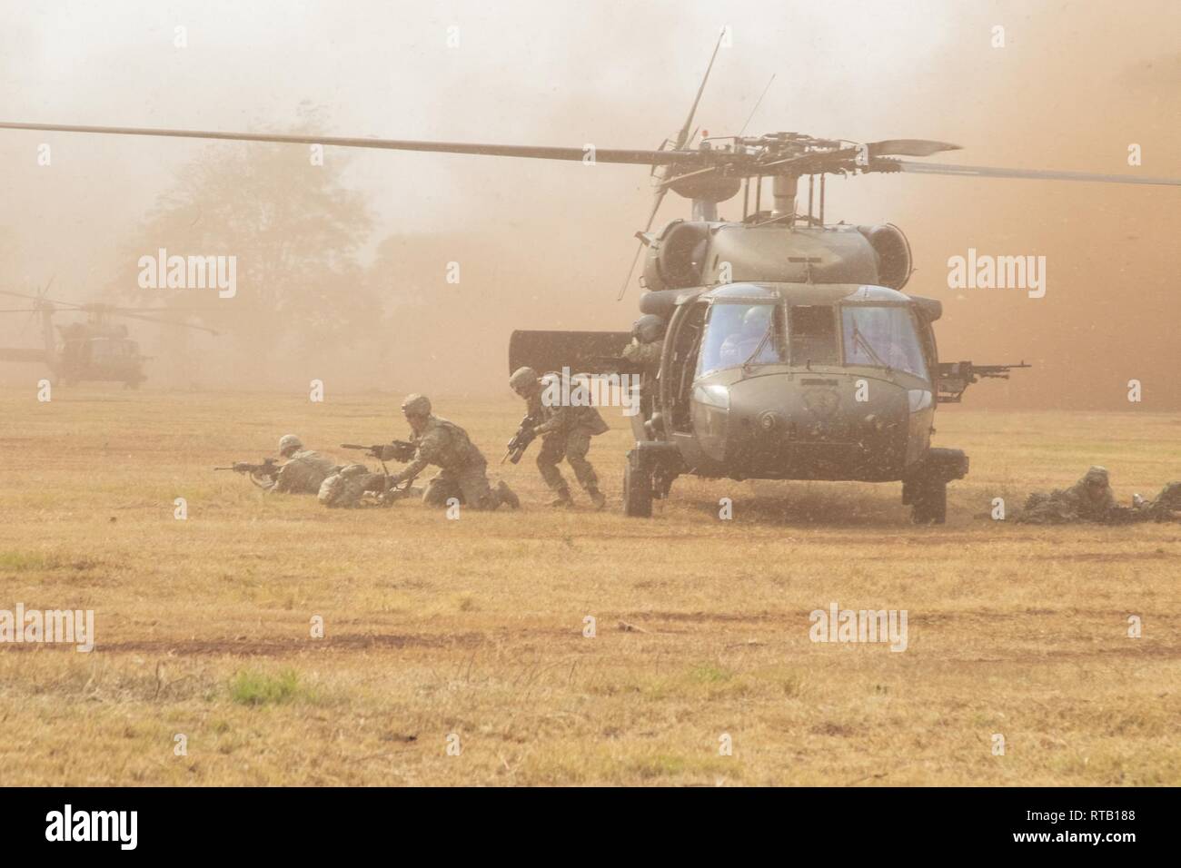 Soldiers with the Royal Thai Army and the U.S. 5th Battalion, 20th Infantry Regiment, exit a ...