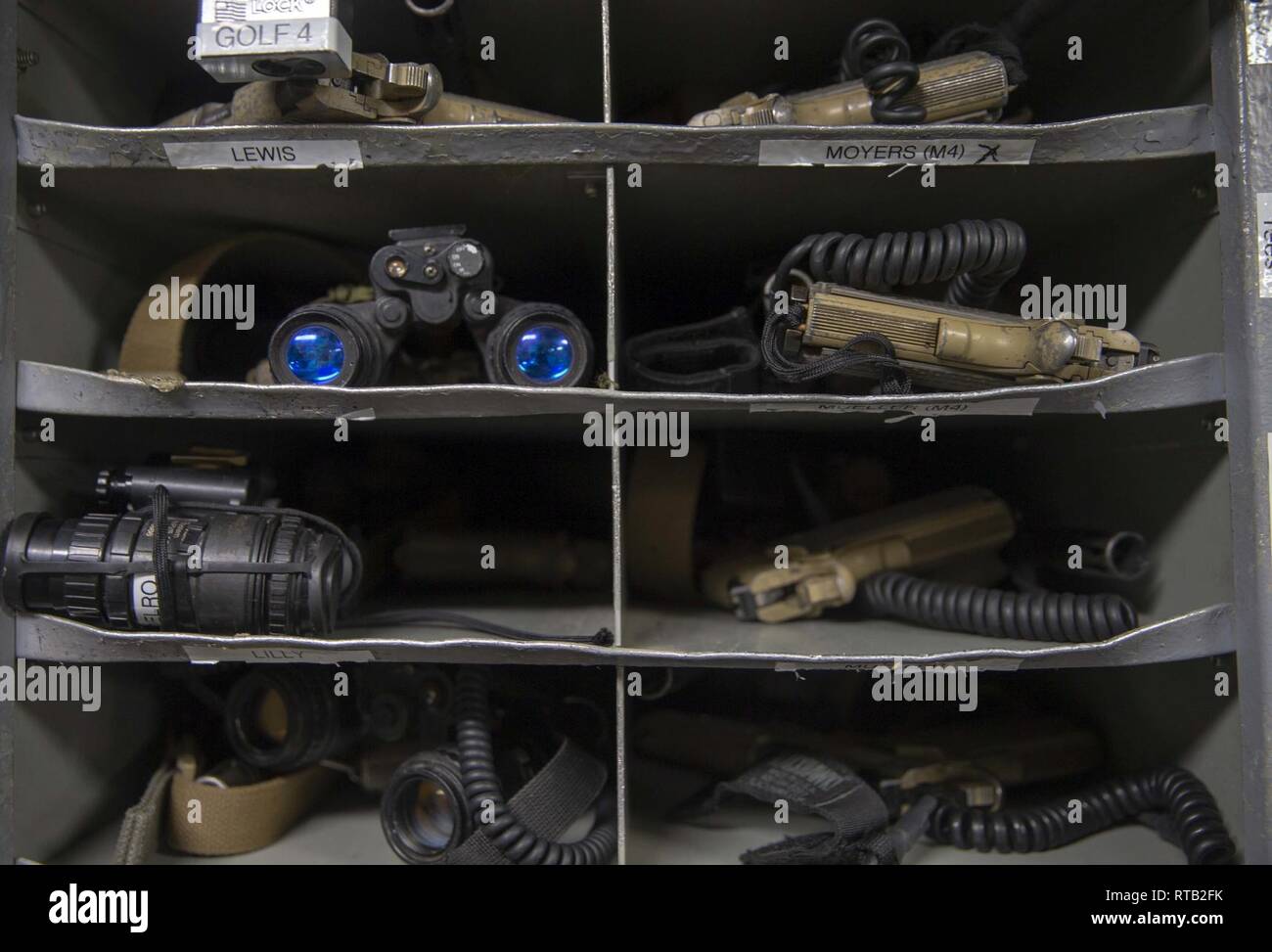 A Marine’s PVS-31 night vision optics are secured in the armory of the ...