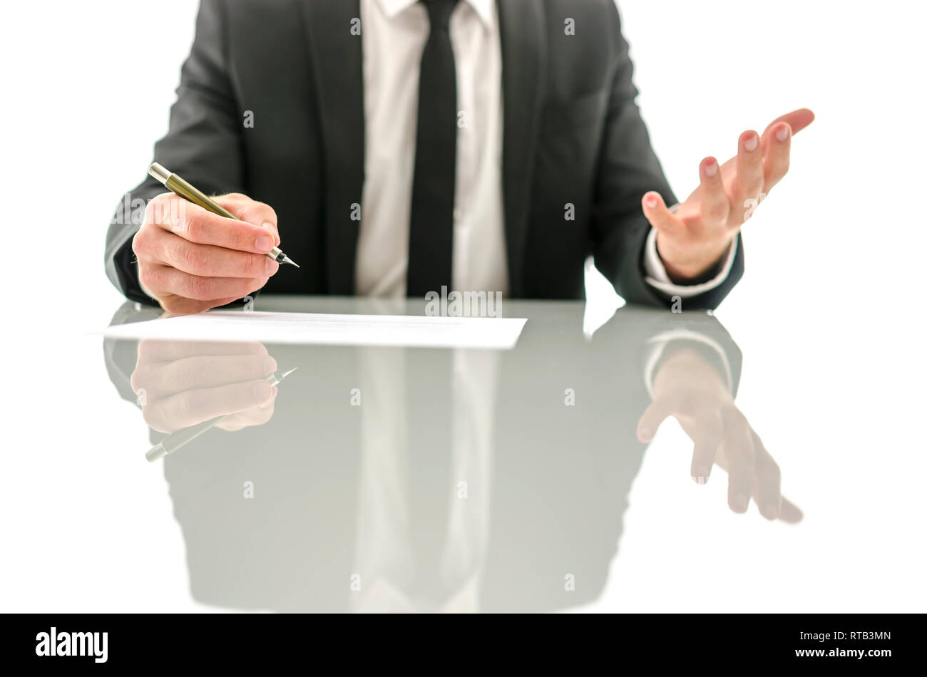 Frustrated gesture of a businessman signing papers. Isolated over white ...