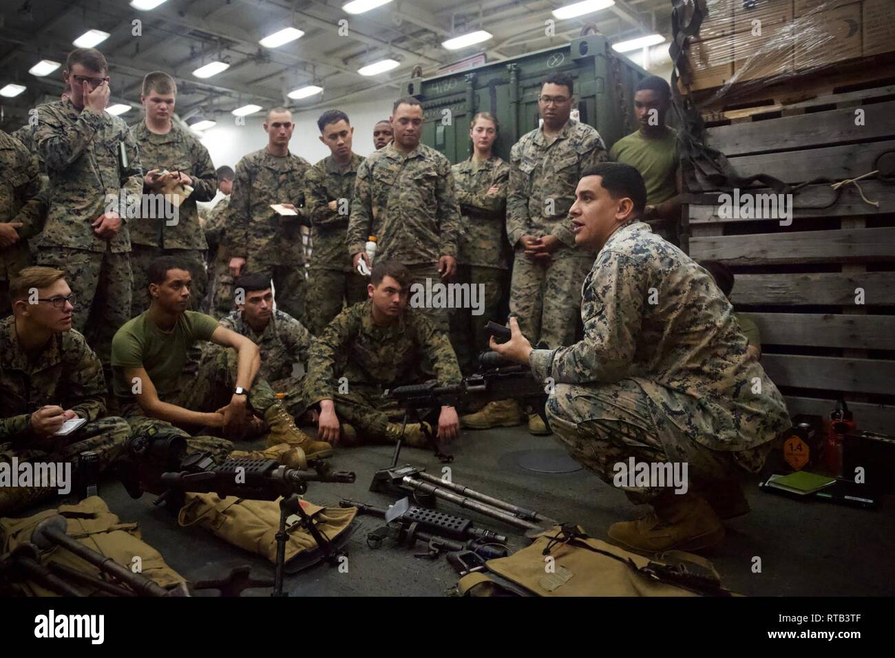U.S. Marine Corps Sgt. David Steele, right, a small arms technician ...