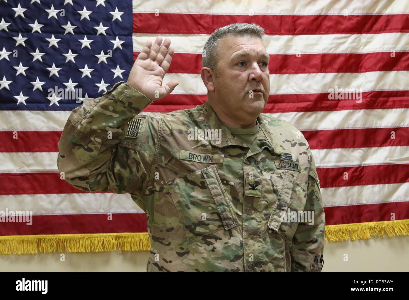 Col. Jonathan Brown recites the oath of office given by Brig. Gen ...