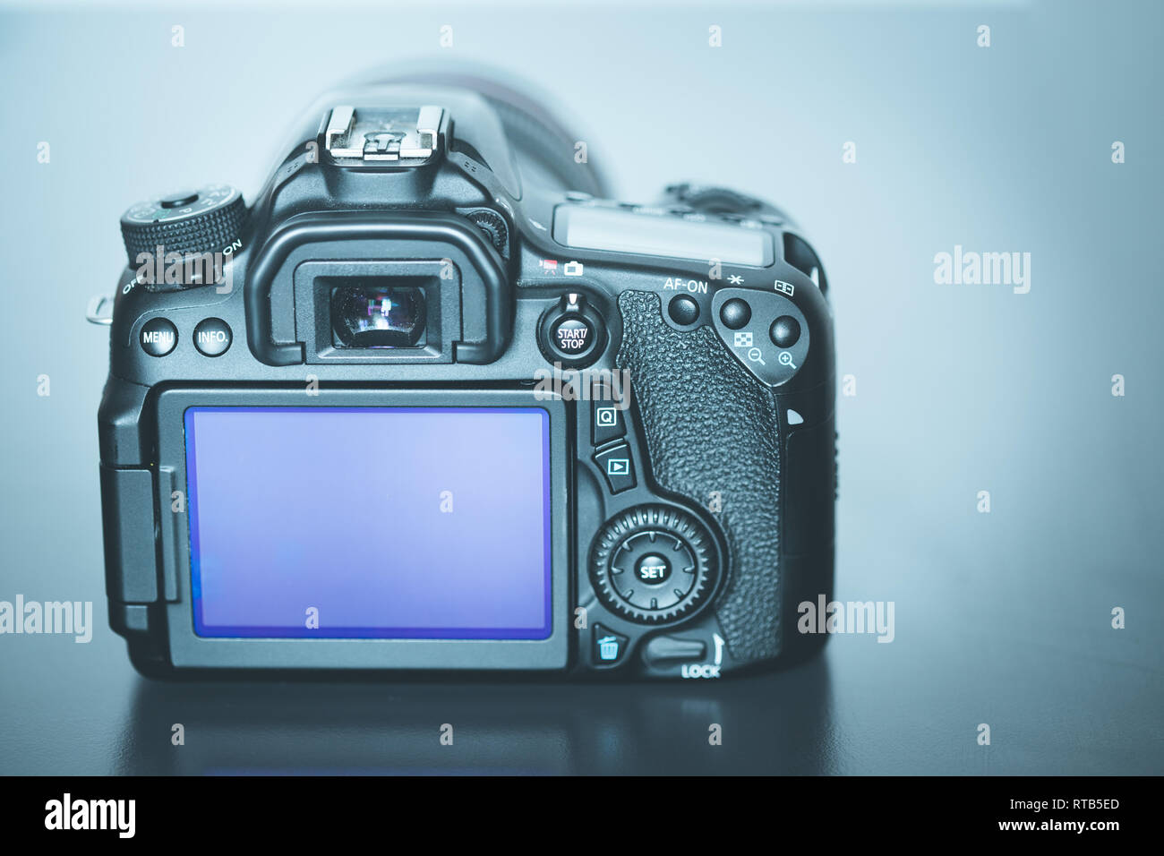 Professional photographing: Back view of a professional reflex camera ...