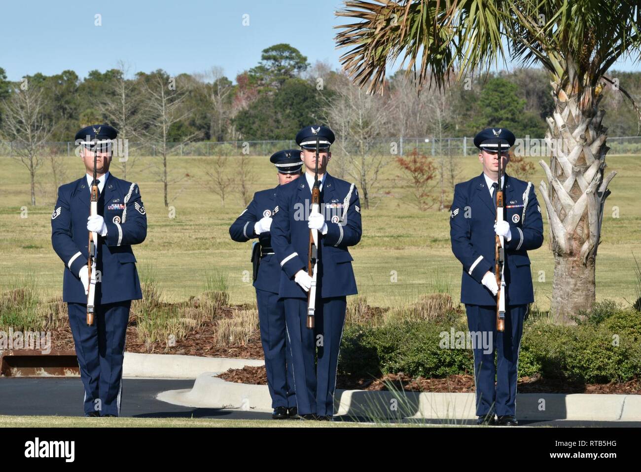 Patrick Air Force Base Honor Guard perform a three volley salute for ...