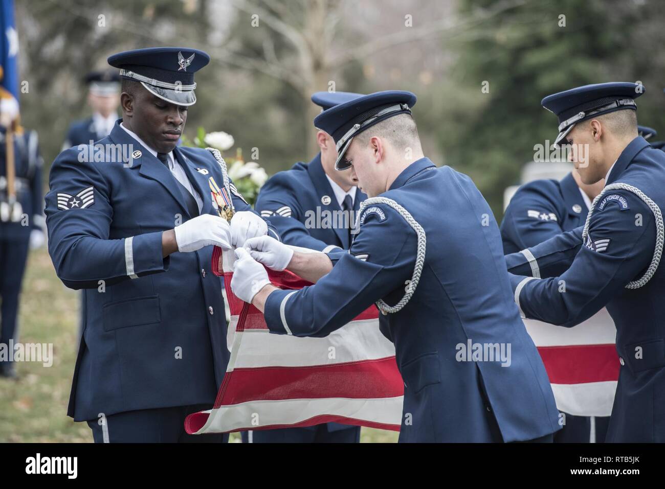 The U.S. Air Force Honors Guard body bearers fold the U.S. flag as part ...