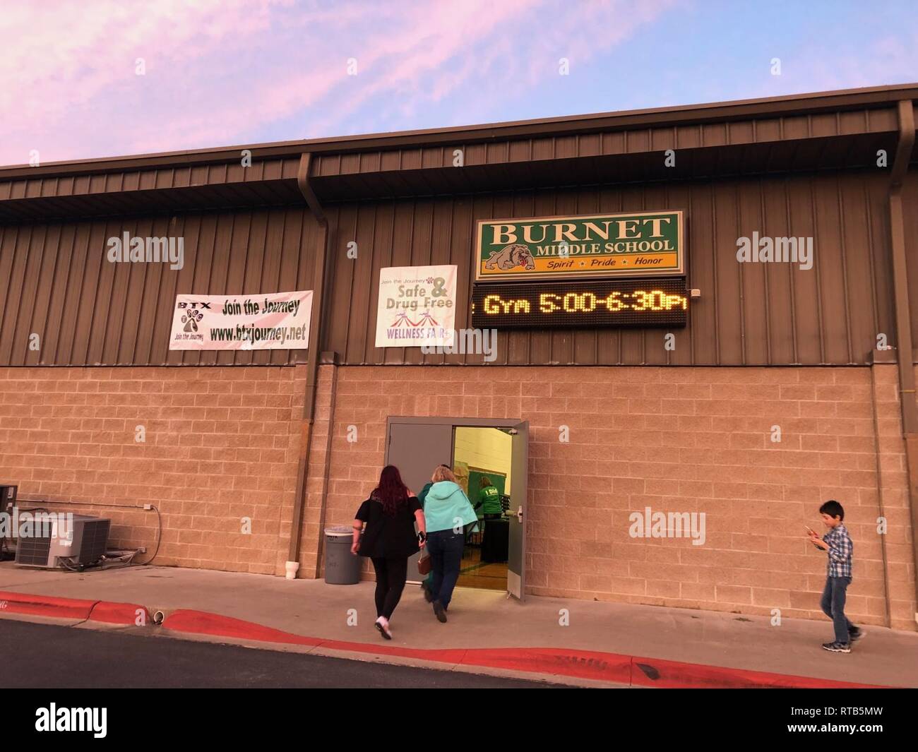 BURNET, Texas---Students and parents enter the Burnet Middle School ...