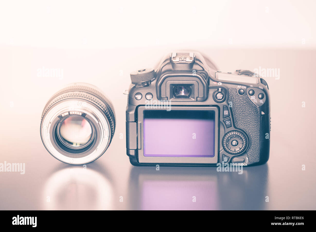 Back view of a professional reflex camera with flip lsd screen and a ...