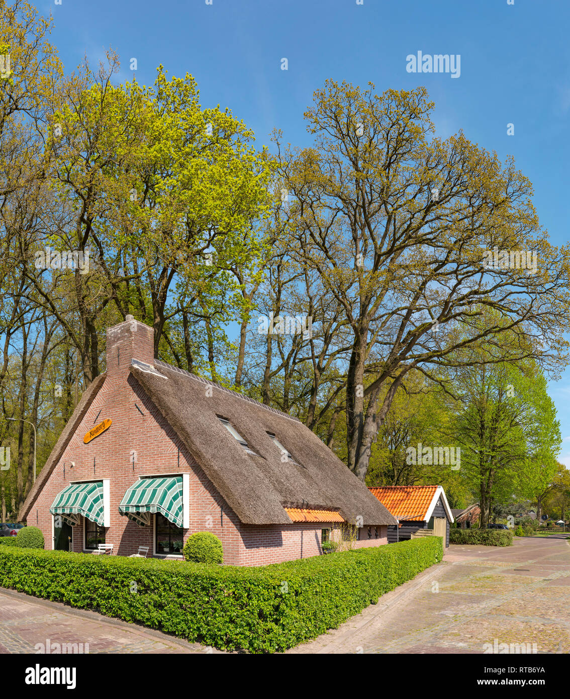 Farmhouse with trees all around Stock Photo - Alamy