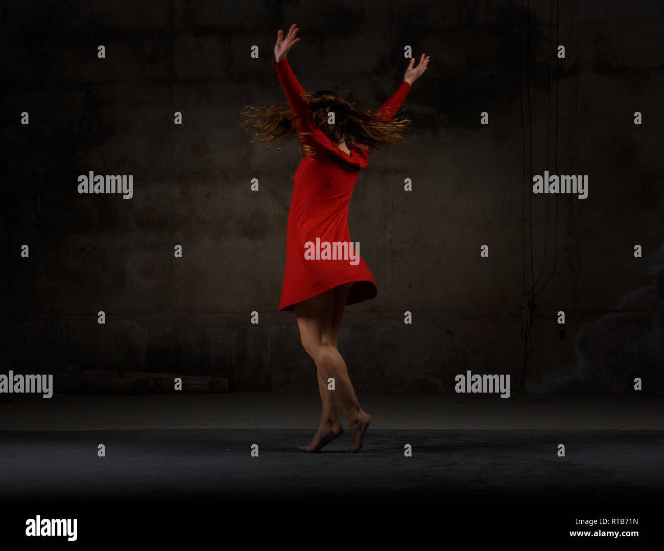 Young Woman dancing in darkness Stock Photo - Alamy