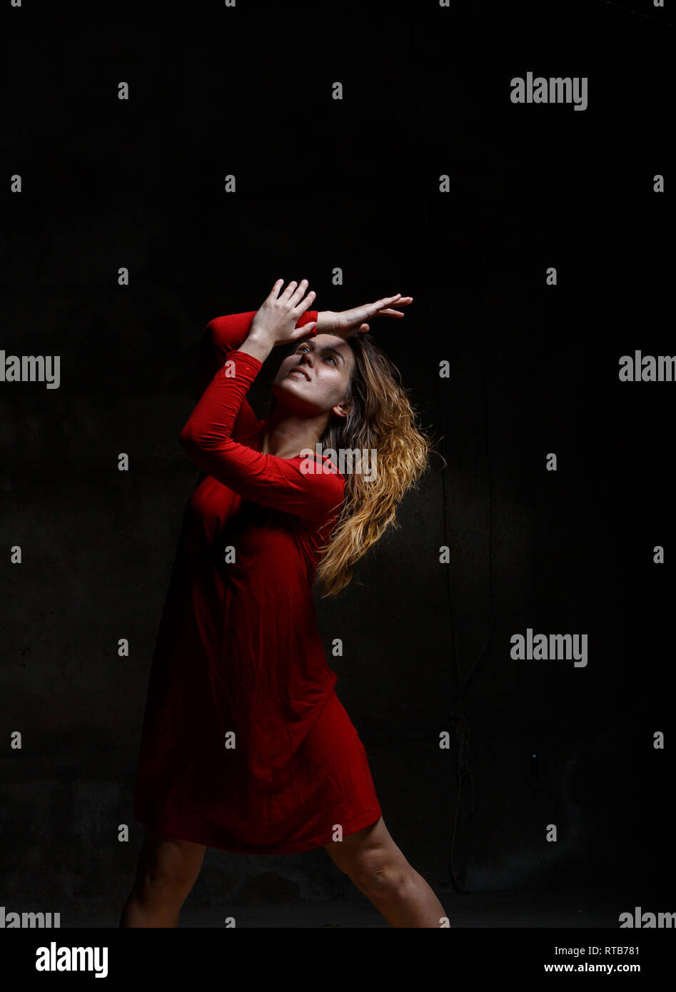 Young Woman dancing in darkness Stock Photo - Alamy
