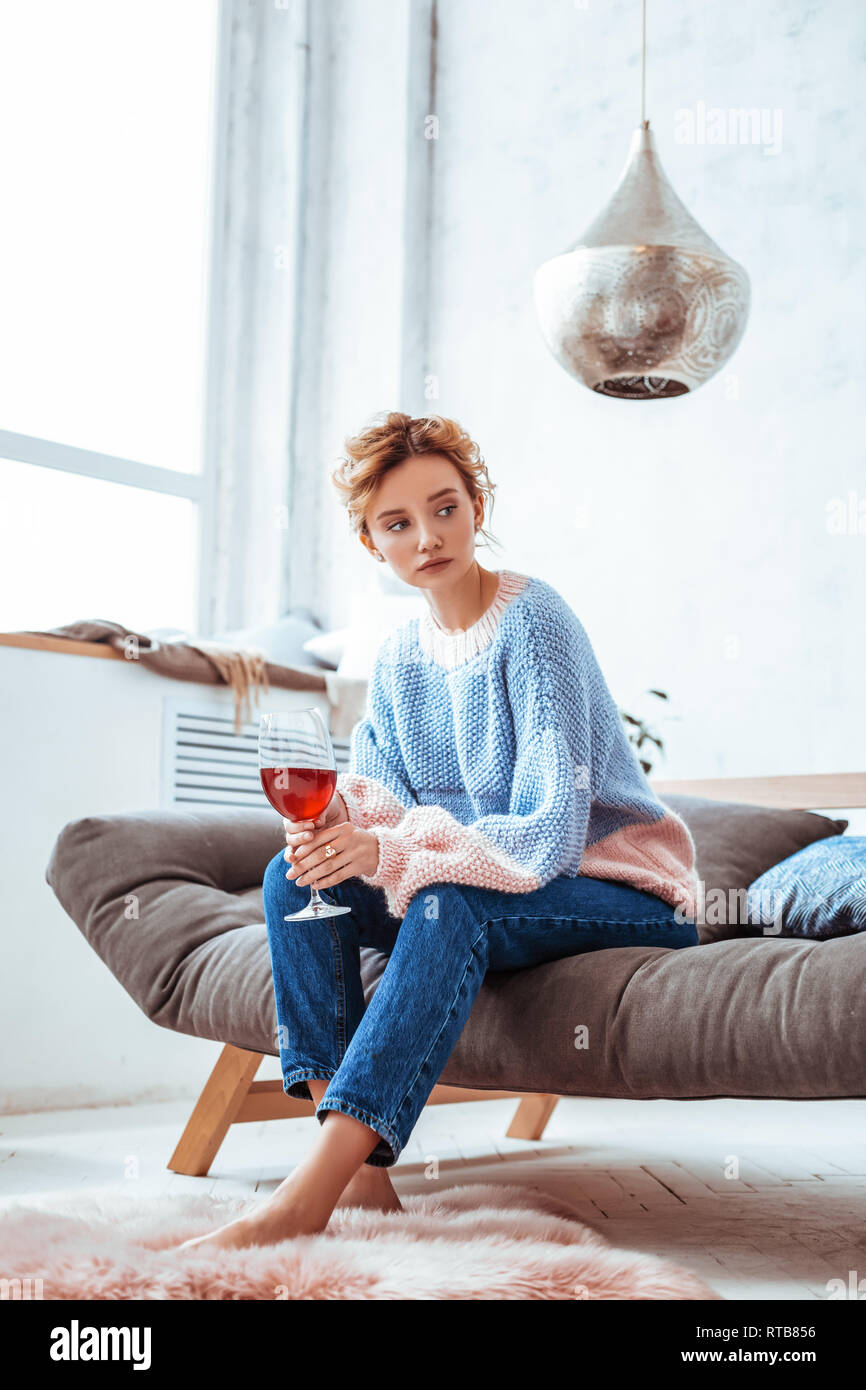 Pleasant good looking woman feeling lonely at home Stock Photo - Alamy