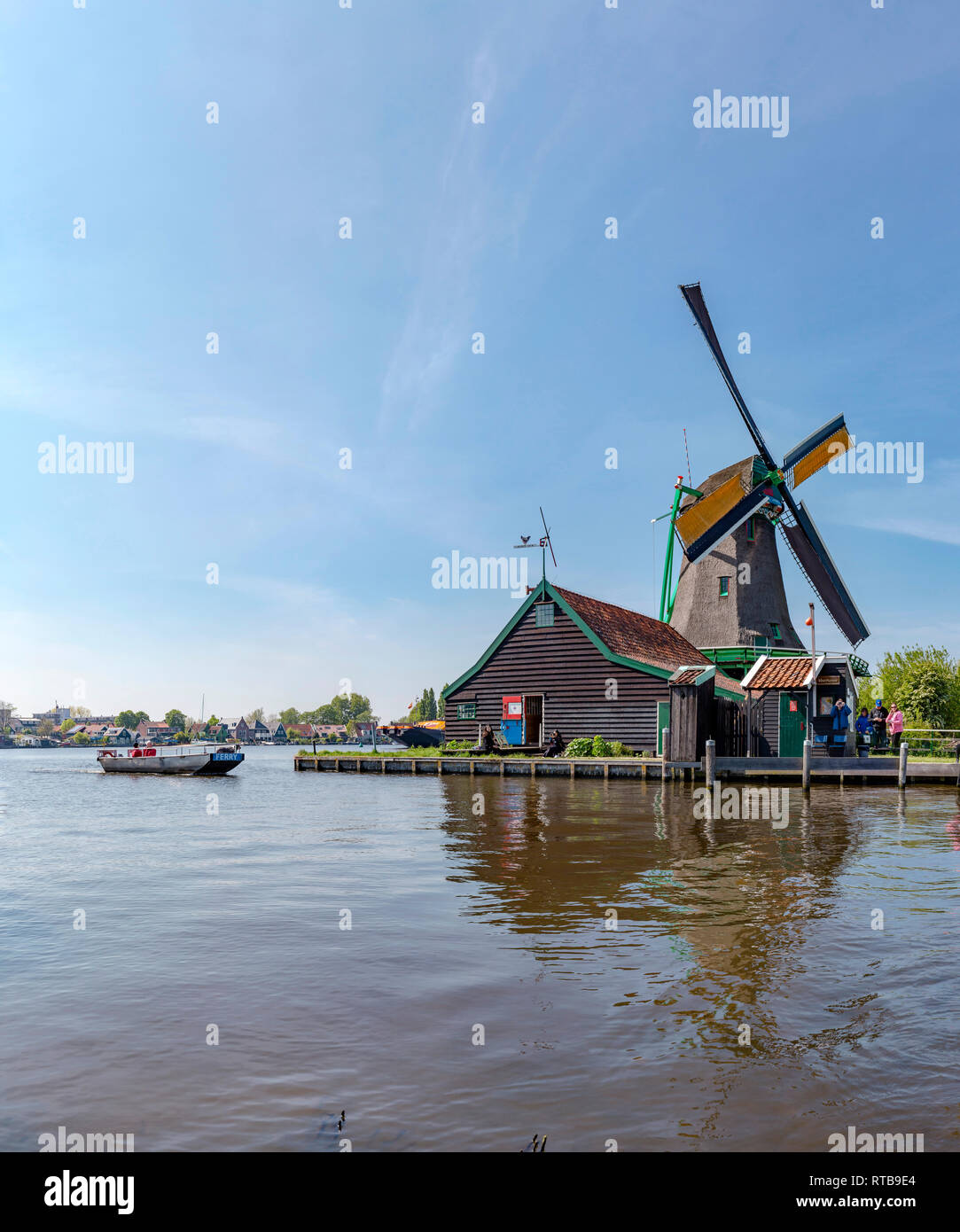 Windmill called De Bonte Hen along the river Zaan Stock Photo - Alamy