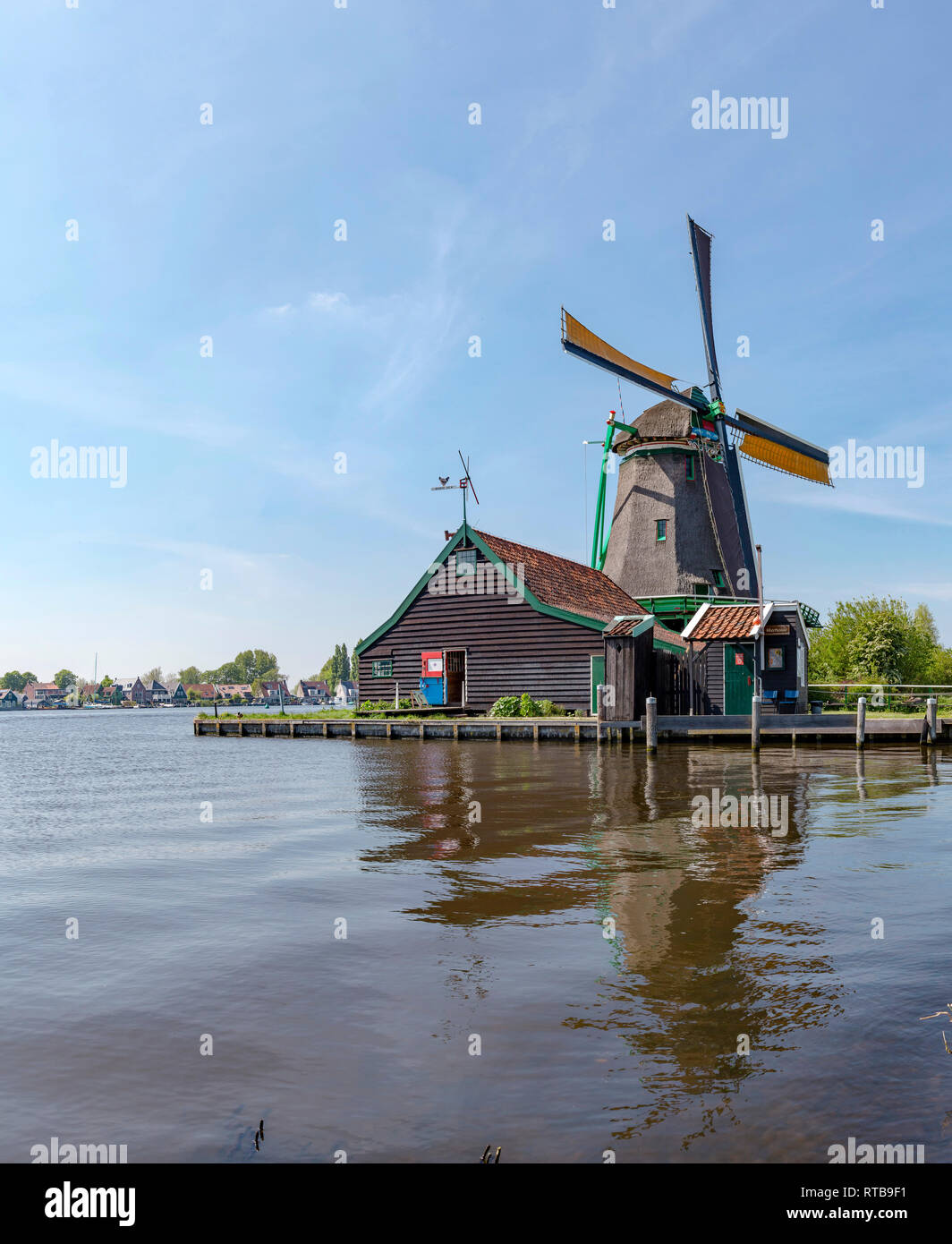 Windmill called De Bonte Hen along the river Zaan Stock Photo - Alamy