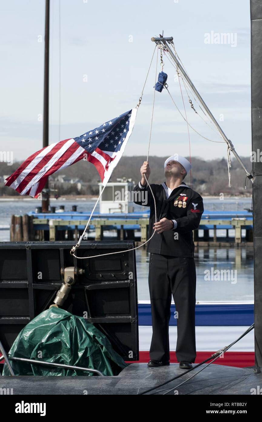 ETV2 (SS) Mark Gonzalez hoists the national ensign moments after USS ...