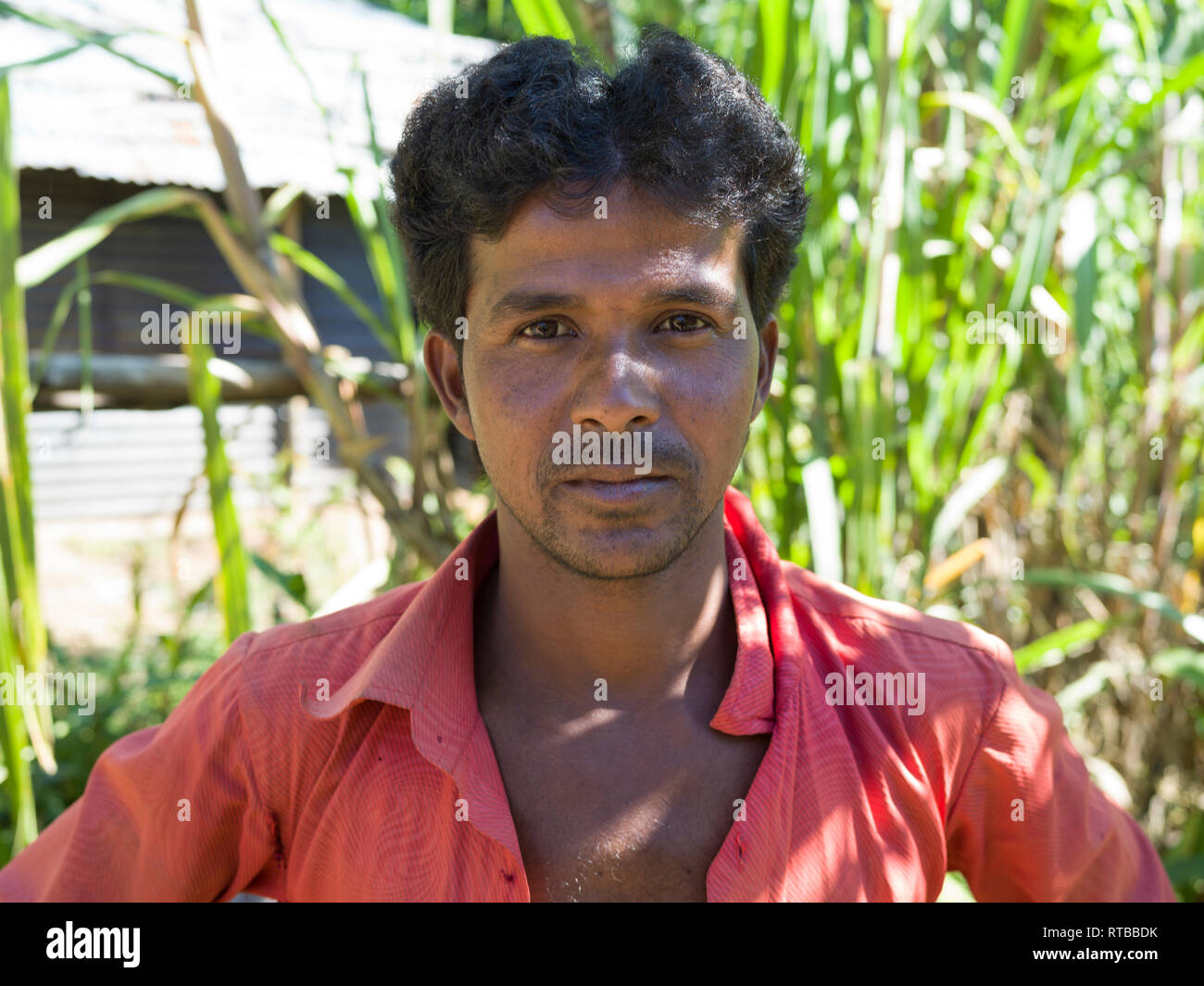 Portrait of man standing in field, Yangthang Village, Gyalshing, West ...