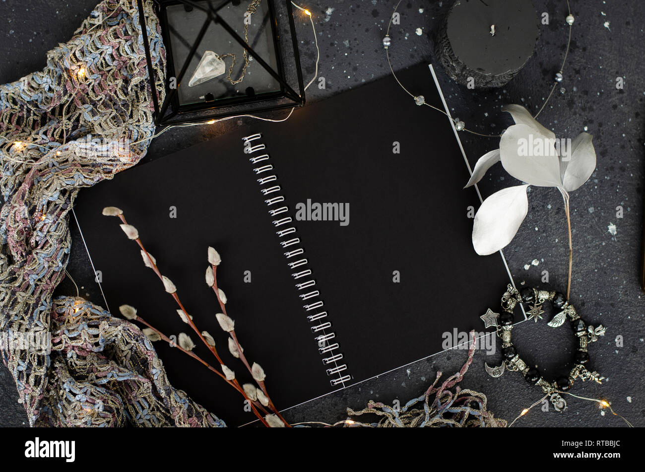 Opened notebook with black sheets on dark background. Top view Stock ...