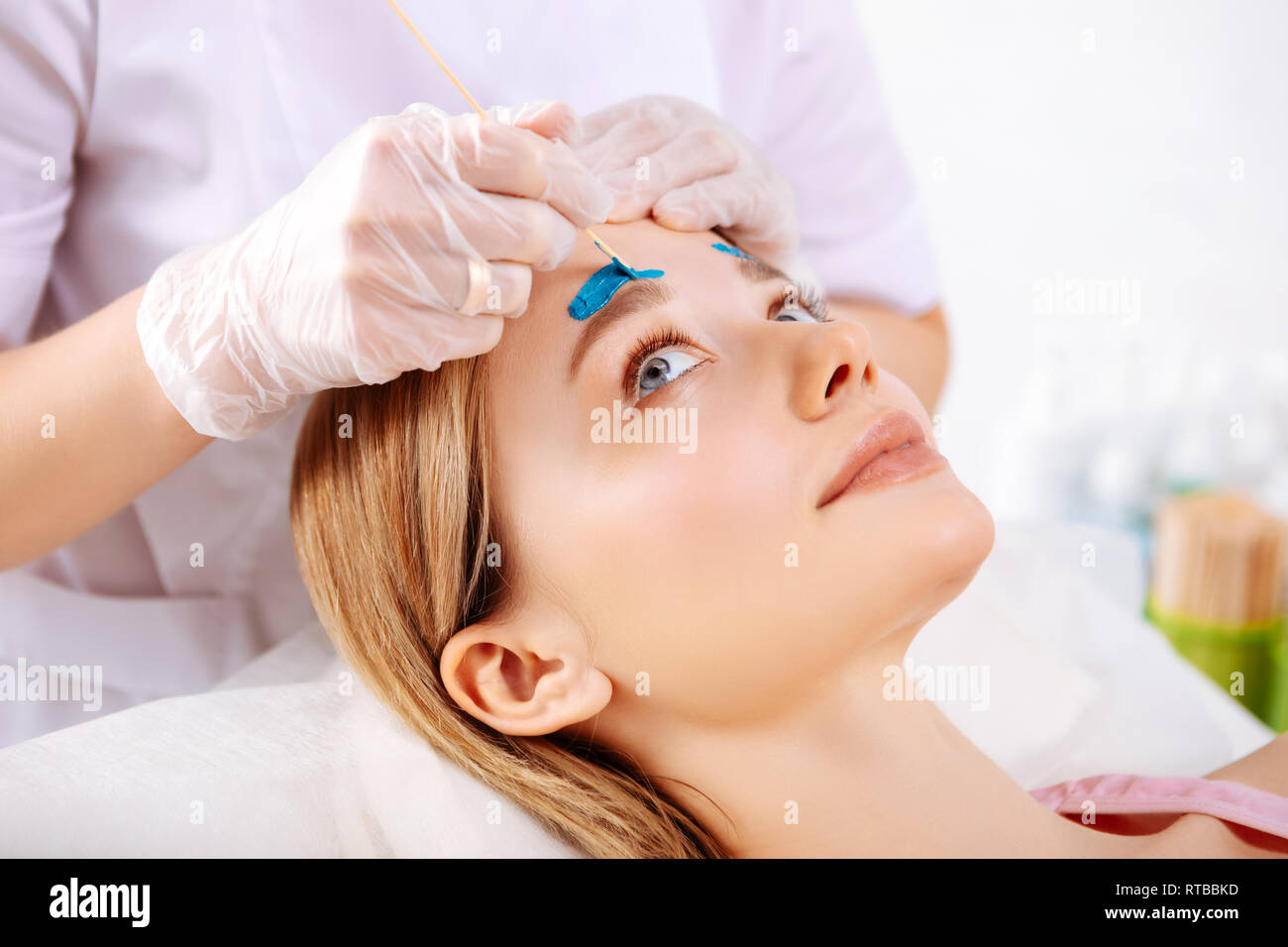 Client feeling concerned having eyebrows depilation for first time ...