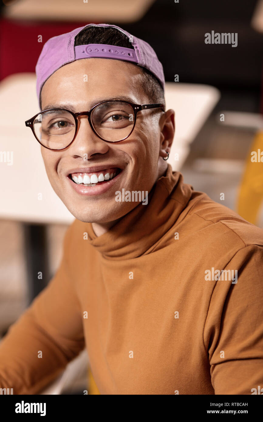 Portrait of guy who looking into the camera and enjoying meeting with ...