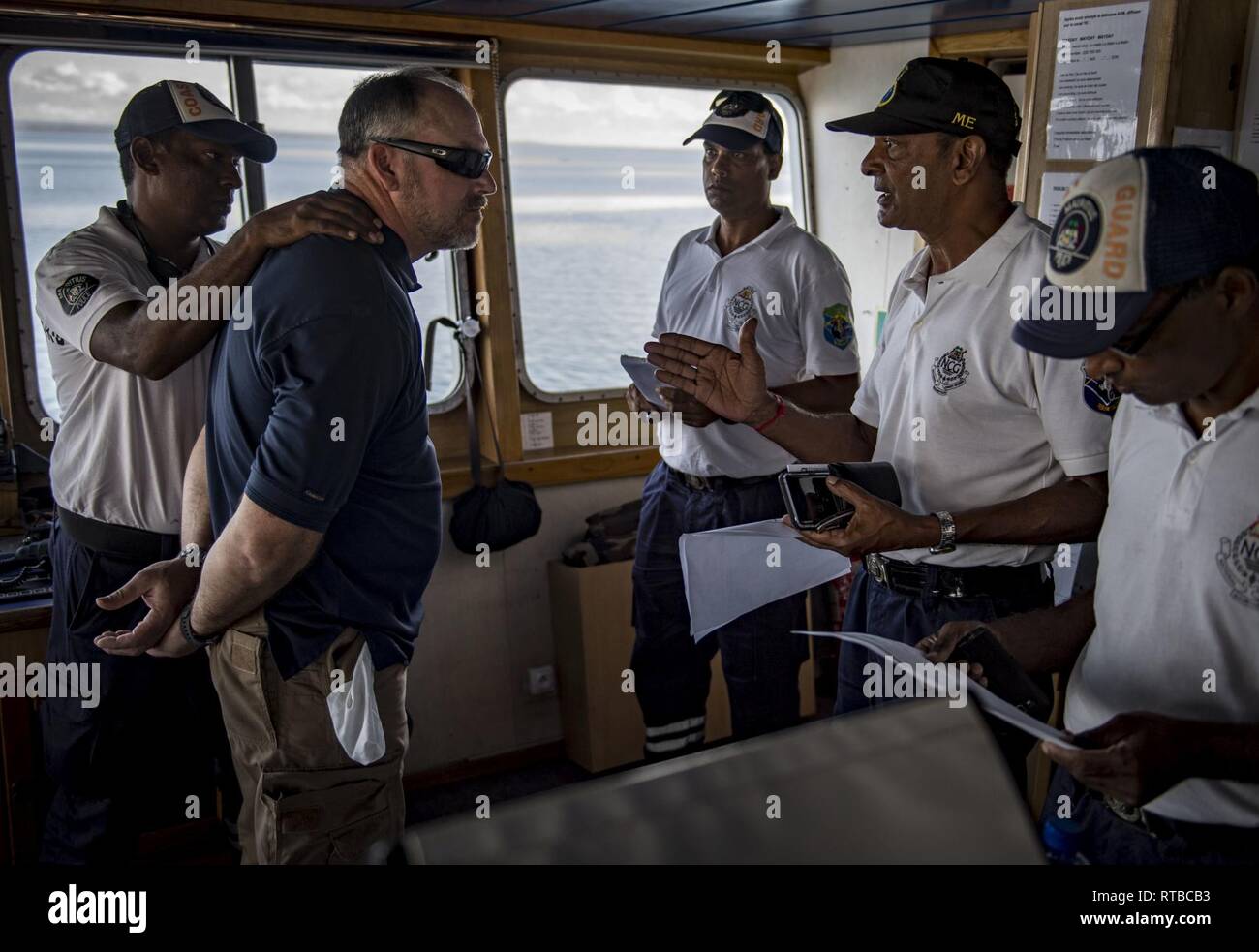 PEMBA, Mozambique (Feb. 3, 2019) Lt. Cmdr. Jerry Wilkins, second from ...