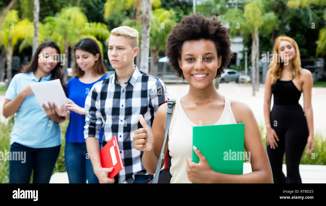 Beautiful brazilian female student with group of international people ...