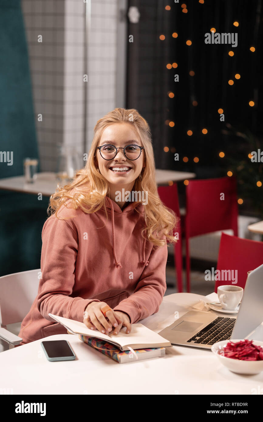 Close up portrait of blond girl looking behind the camera Stock Photo ...