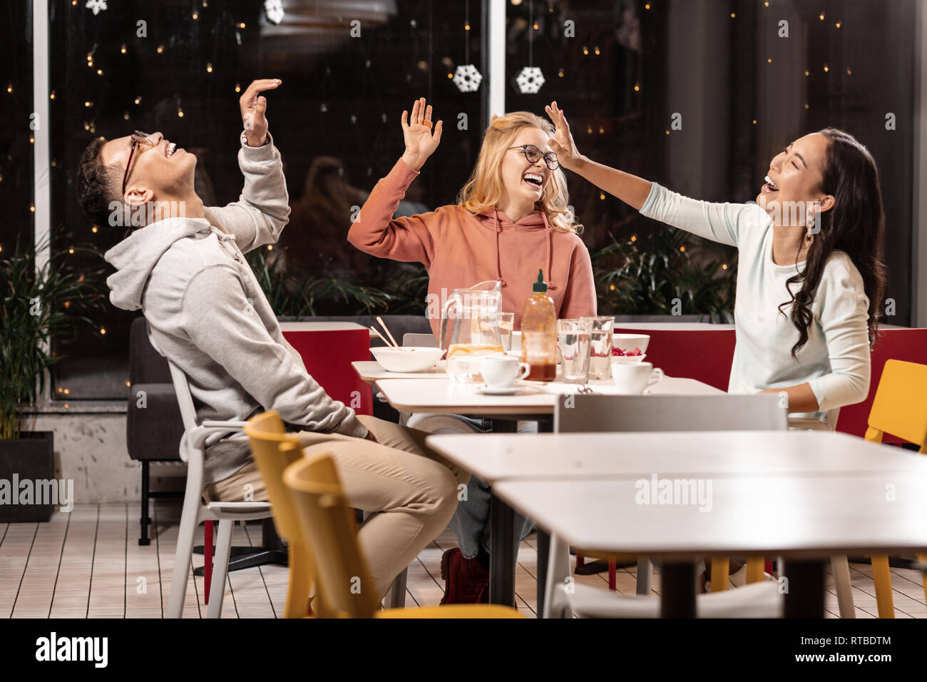 Young adult friends fooling around hi-res stock photography and images ...