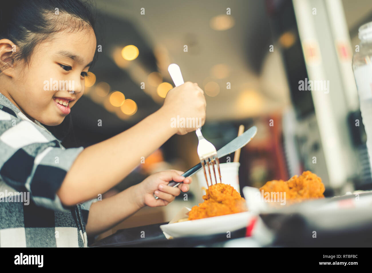 Asian Children Eating Fried Chicken Food Court Stock Photo - Alamy