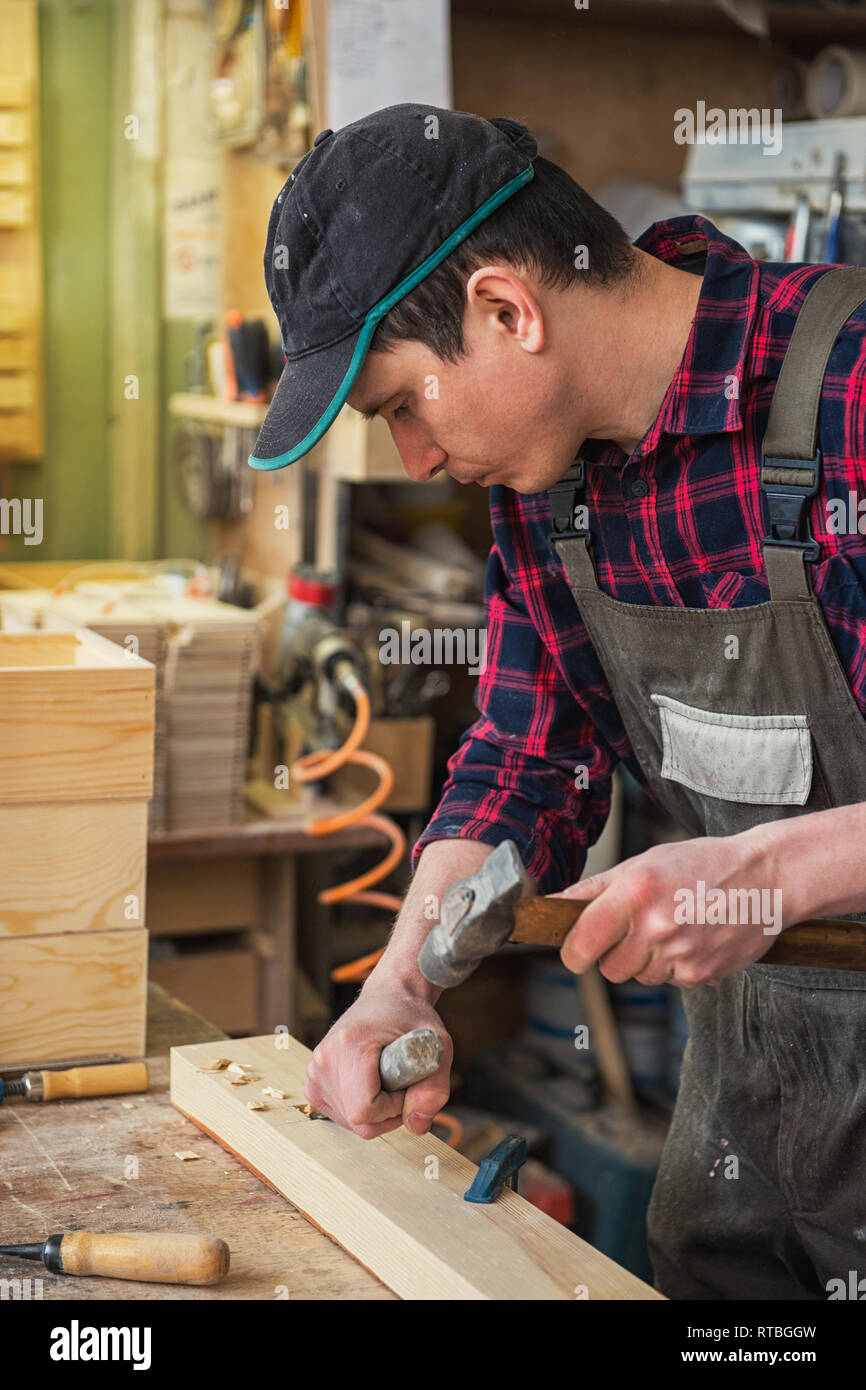 Carpenter working with a chisel Stock Photo - Alamy
